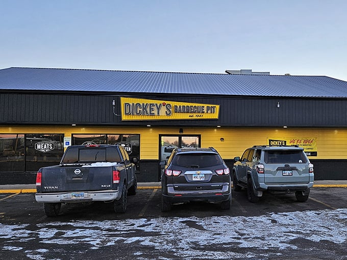 Bright yellow building, bold black letters - Dickey's doesn't whisper about their BBQ, they shout with pride.