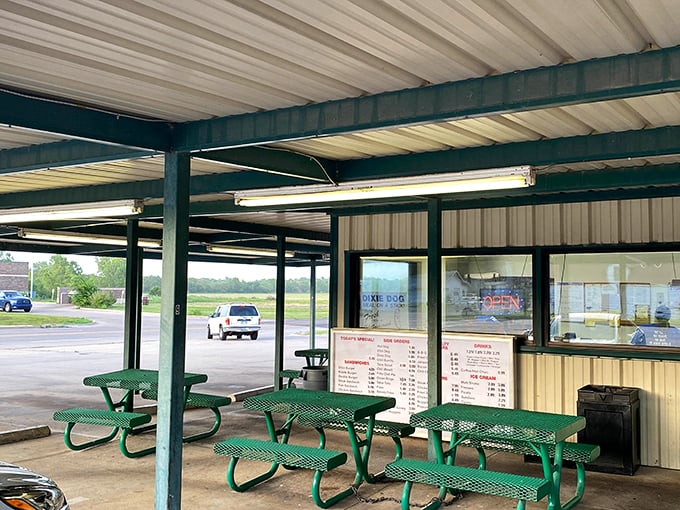 Where nostalgia meets lunch. This charming green drive-in proves that sometimes the tastiest treasures come in the most unassuming packages.
