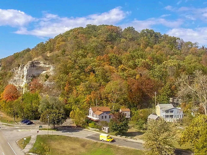 Elsah nestles against limestone bluffs like a village playing hide-and-seek with the modern world. That yellow truck is probably the newest thing in town.