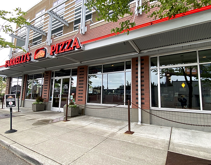 Farrelli's brick-and-glass facade stands ready for pizza seekers. Modern meets traditional in this Tacoma neighborhood favorite.