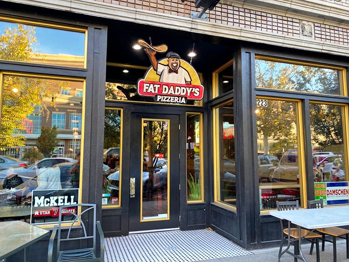 Fat Daddy's bold storefront promises big flavor without the fuss. That cheerful pizza-tossing logo is practically winking at you!