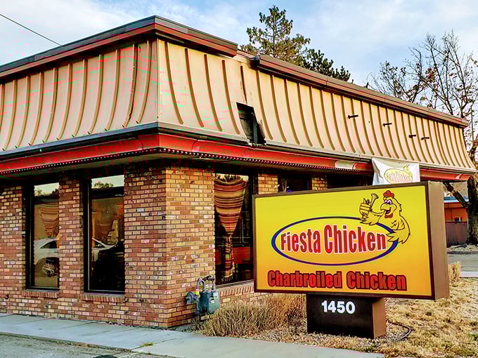 Fiesta Chicken's bright yellow sign promises a party for your palate. This unassuming brick building houses charbroiled treasures that redefine fried chicken.