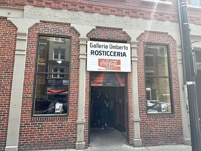 Galleria Umberto's vintage storefront whispers of simpler times when pizza was an art and Coca-Cola signs were forever.