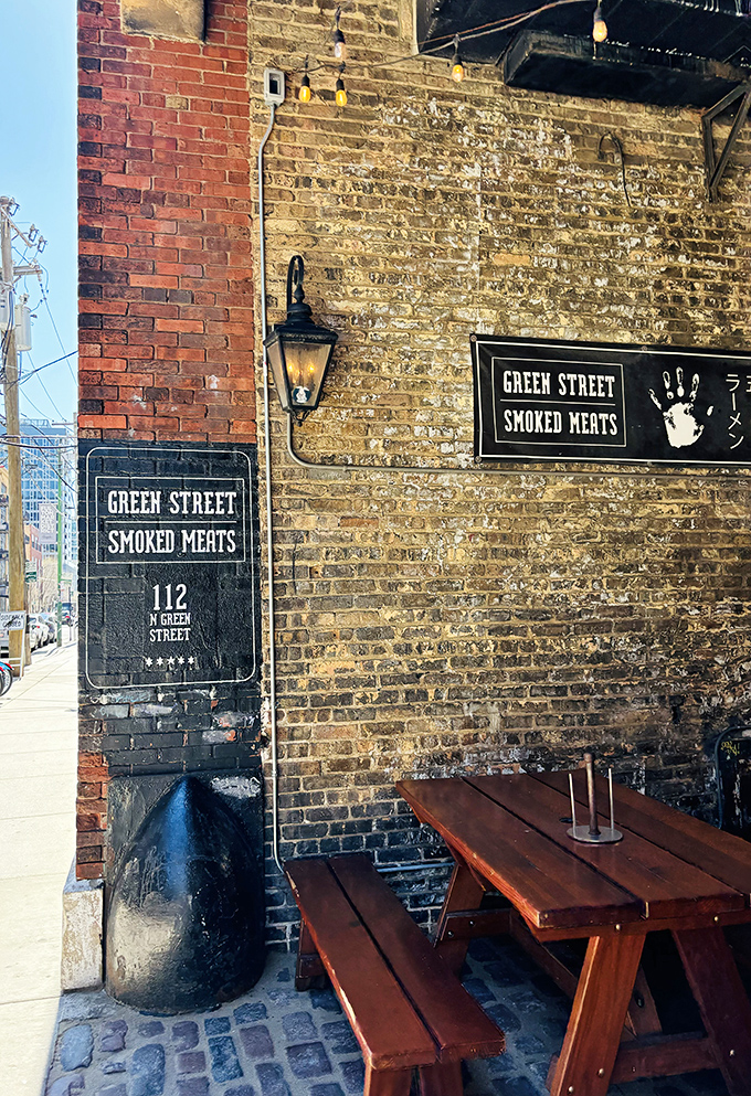 Historic brick walls and lantern light create the perfect stage for Green Street's legendary smoked meat performances.