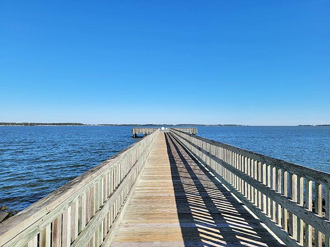 Holts Landing's fishing pier stretches toward the horizon like an invitation to leave your worries on the shore.