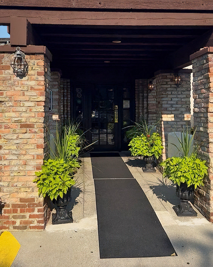Hyde Park's entrance speaks volumes before you even taste the food. Those stone columns and lush plants set the stage for serious steak business.