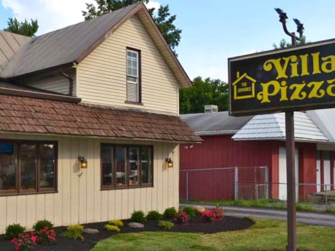 Johnnies Villa Pizza's homey yellow exterior feels like visiting grandma's house&mdash;if grandma made legendary pizza!