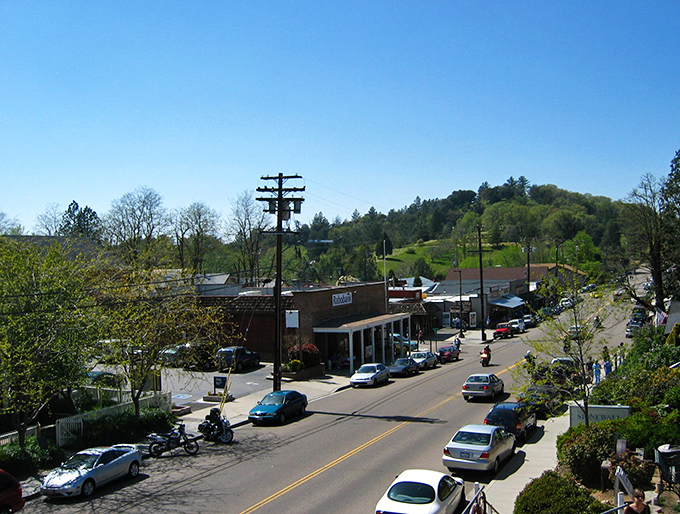 Julian's main street whispers of gold rush days, where modern cars park alongside history that refuses to fade away.
