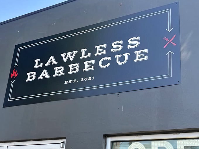 Breaking the rules never tasted so good! This food truck's bold sign promises BBQ rebellion worth joining.
