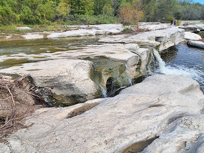 Gentle waters cascade over smooth limestone ledges, nature's version of a luxury spa treatment.