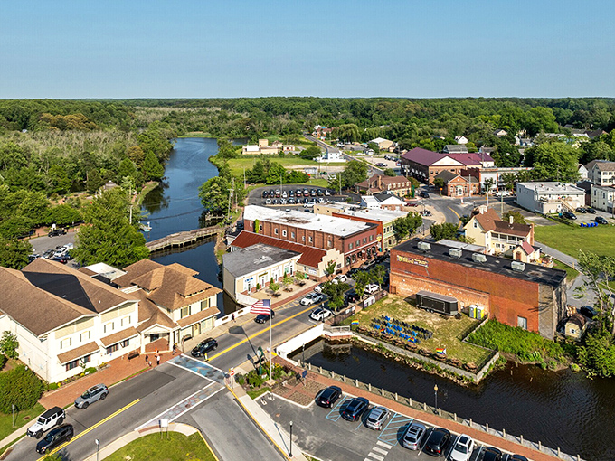Milton's waterfront charm unfolds where the Broadkill River meets historic brick buildings, creating a postcard-worthy scene that time forgot.