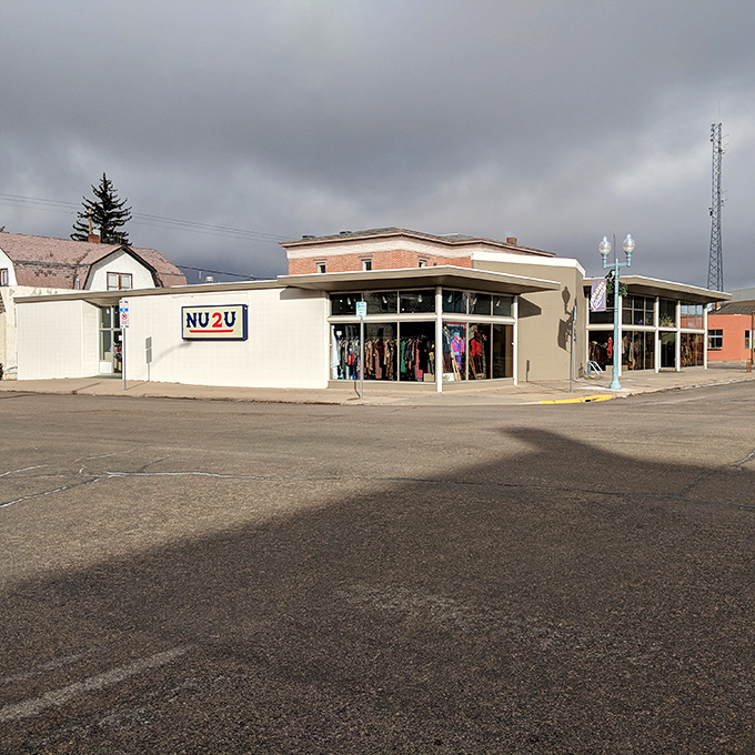 NU2U's retro-modern storefront stands proudly on the corner, beckoning passersby with promises of affordable treasures.