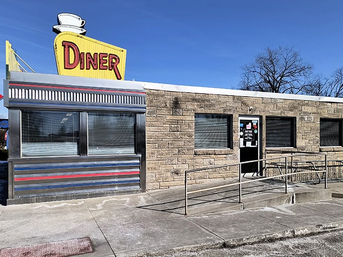 Oasis Diner gleams like a chrome time capsule from the 1950s. This authentic vintage diner serves nostalgia alongside those perfect hash browns.