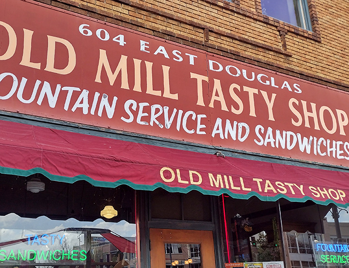 Old Mill Tasty Shop's classic storefront whispers tales of malted milkshakes and childhood memories from another era.