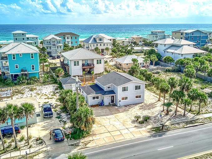 Colorful beach houses line the shore like a box of crayons decided to retire in paradise.