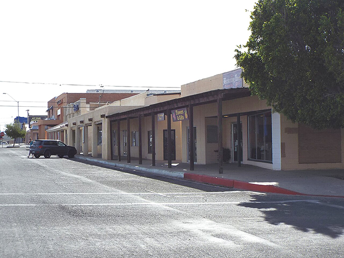 Parker's quiet storefronts bask in the desert sun, waiting for the next customer. Small-town commerce where nobody's in a hurry!