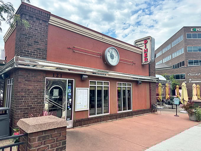 The Phillips Avenue Diner gleams like a '57 Chevy, a chrome-trimmed time machine serving up nostalgia with a side of bacon.