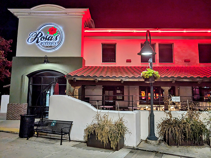 Rosa's Pizzeria lights up the night with its welcoming glow. That red neon promises Italian comfort in every slice.
