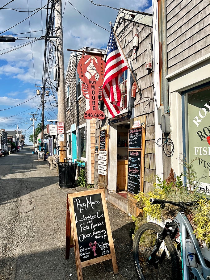 Roy Moore Lobster Co's weathered sign and American flag announce: serious seafood ahead. This Rockport institution is where lobster meets authenticity.