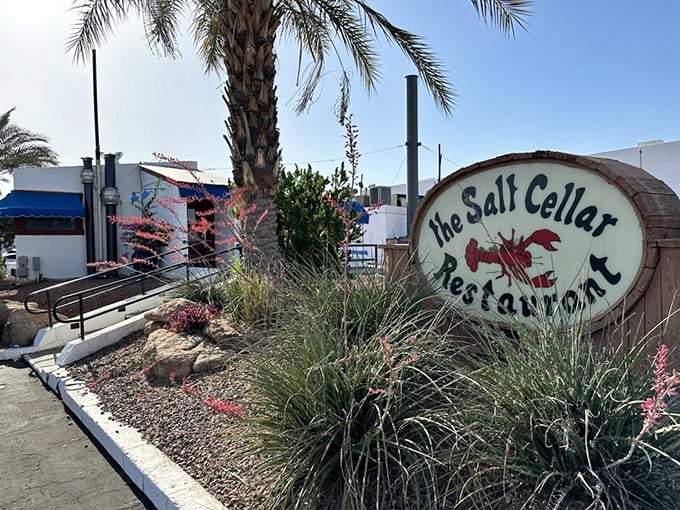 The Salt Cellar's modest entrance and barrel sign give little hint of the underground seafood paradise below. Some treasures are worth seeking below the surface.