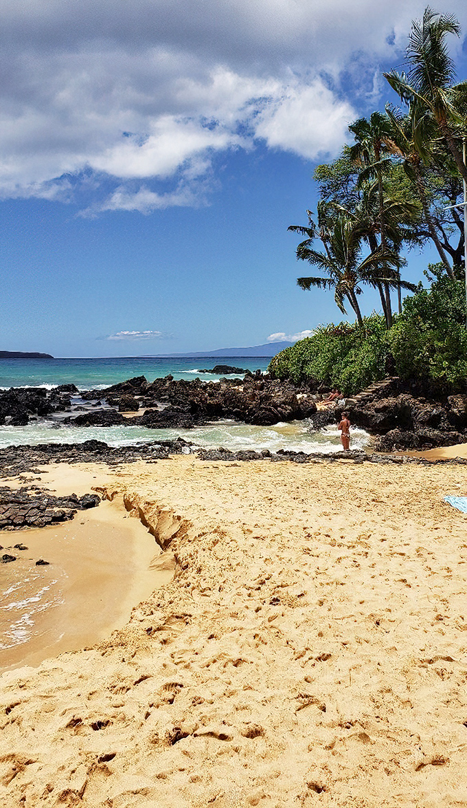Secret Cove's intimate shoreline proves good things come in small packages. The contrast between turquoise waters and black lava rock creates nature's perfect frame.