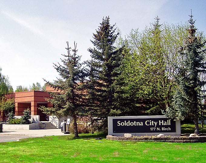 Soldotna City Hall: where small-town charm meets practical living. Your Social Security check goes further when surrounded by evergreens instead of skyscrapers!