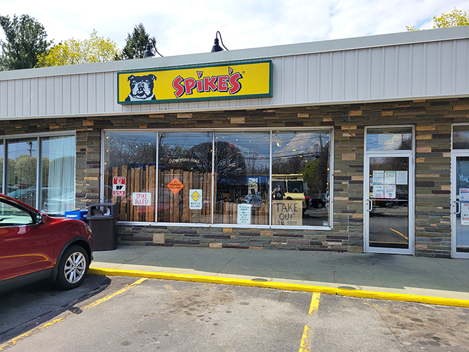 Spike's bold yellow sign and bulldog mascot stand guard over some of Warwick's most creative hot dog creations.