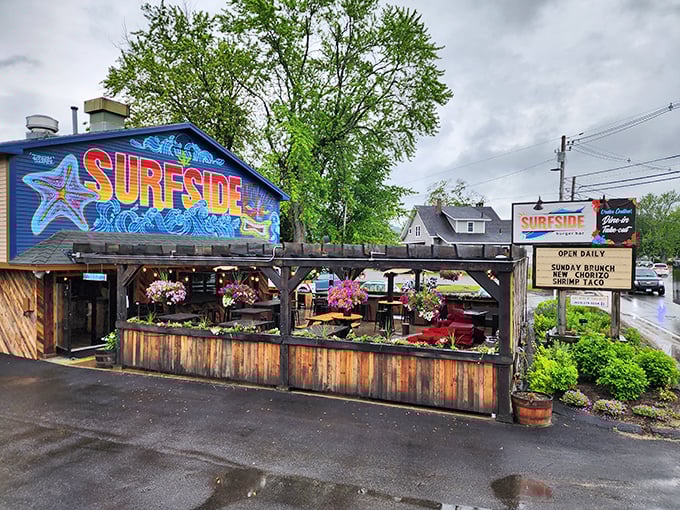 Surfside's vibrant blue building and wooden deck create the perfect backdrop for burger bliss, rain or shine.