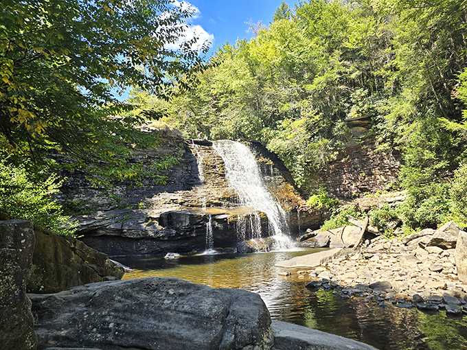 Swallow Falls' misty cascade tumbles dramatically over dark rocks, like Mother Nature's version of a spa treatment.