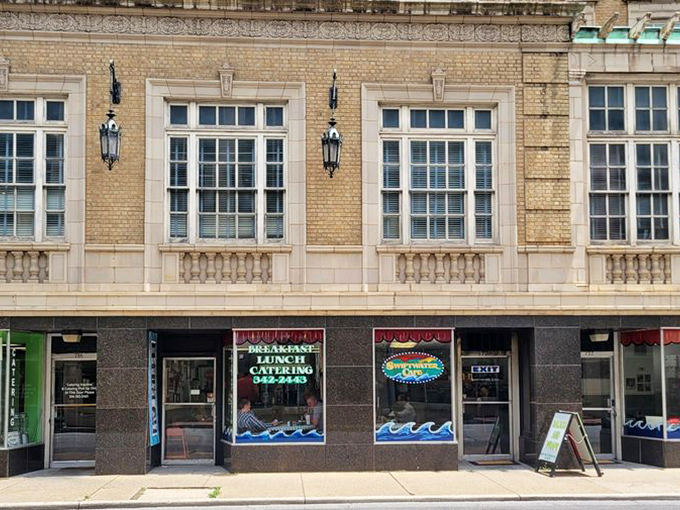 Swiftwater's storefront windows frame the kind of downtown breakfast scene that makes city living feel wonderfully civilized and inviting.