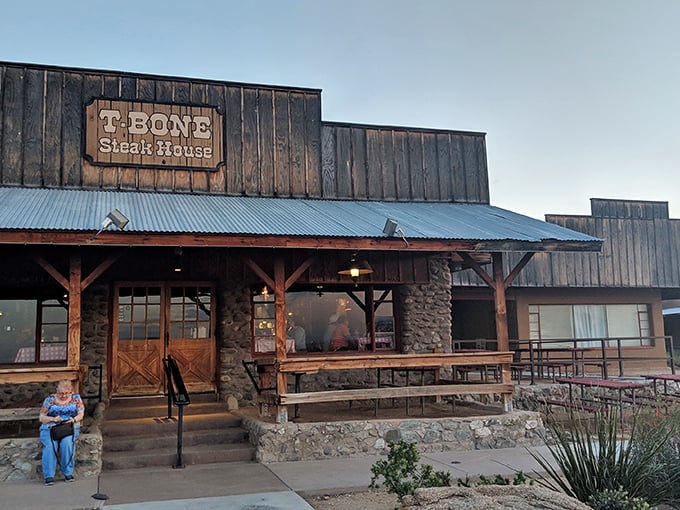 T-Bone Steakhouse embraces its rustic roots with weathered wood and metal roofing. John Wayne would feel right at home here.