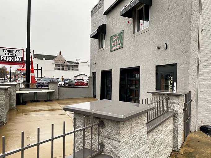 The industrial-chic look works perfectly when you're serving up slices that taste like pure neighborhood nostalgia.