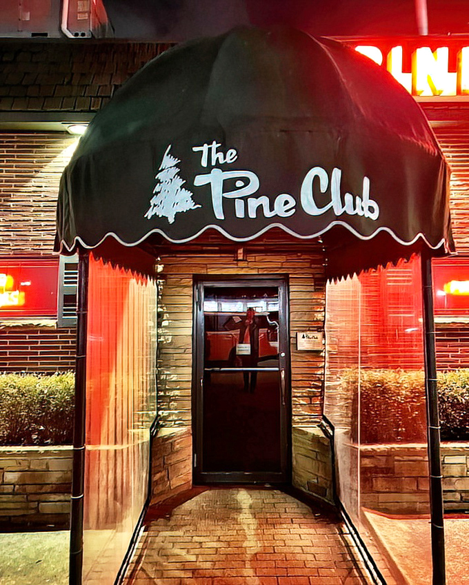 The Pine Club's iconic entrance promises old-school excellence. That neon sign has guided hungry Ohioans to steak perfection for decades.