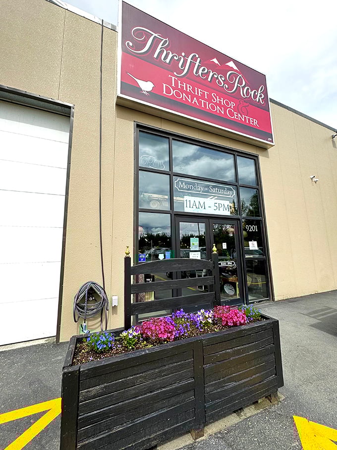 Thrifters Rock welcomes visitors with cheerful flowers and a promise of hidden treasures within.