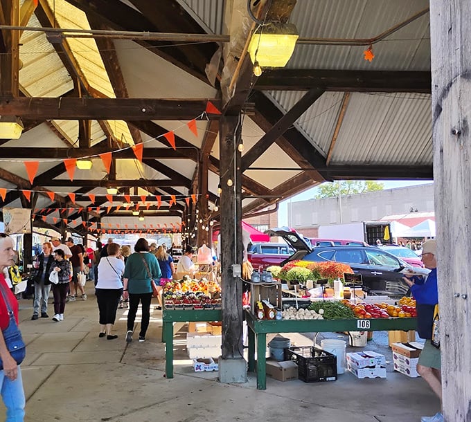 Toledo Farmers' Market's wooden cathedral of freshness shelters shoppers and sellers alike. Those beams have witnessed countless "I'll take two" moments!