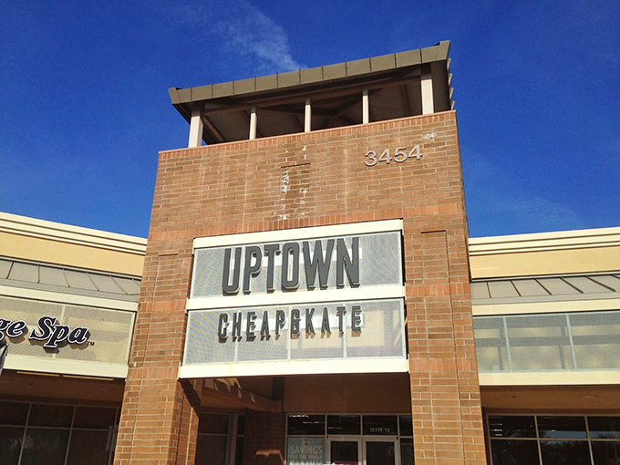 Uptown Cheapskate's brick tower stands like a lighthouse, guiding fashion-conscious bargain hunters to safer financial shores.
