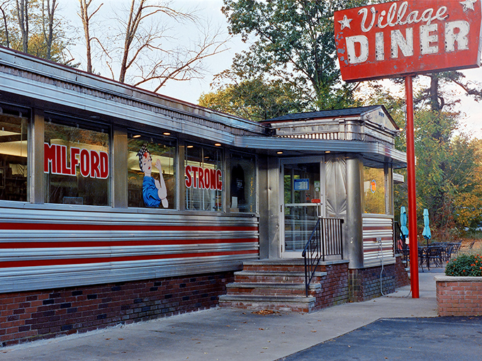 "Milford Strong" proclaims this classic silver diner, standing proud with its vintage sign and timeless appeal.