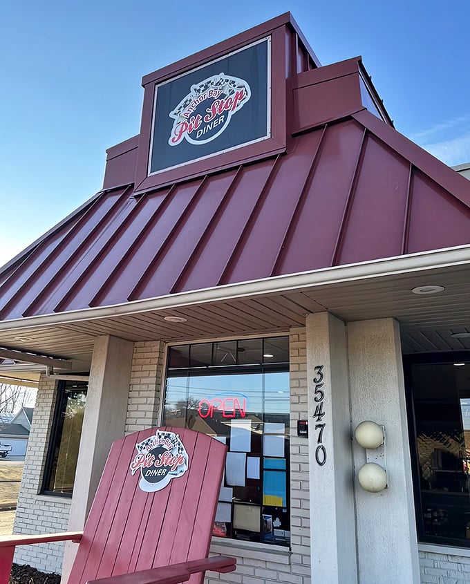 Anchor Bay Pit Stop (entrance): That burgundy roof isn't just for looks&mdash;it's a landmark for hungry travelers. The kind of place where "regular" is a badge of honor.