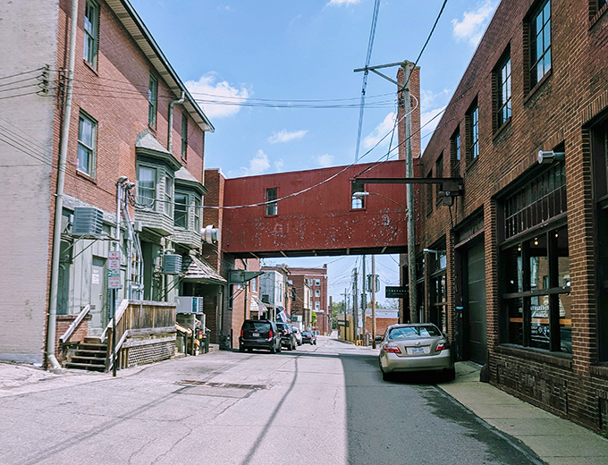 Quiet residential streets stretch peacefully ahead, promising the kind of tranquility that expensive gated communities try desperately to replicate artificially.