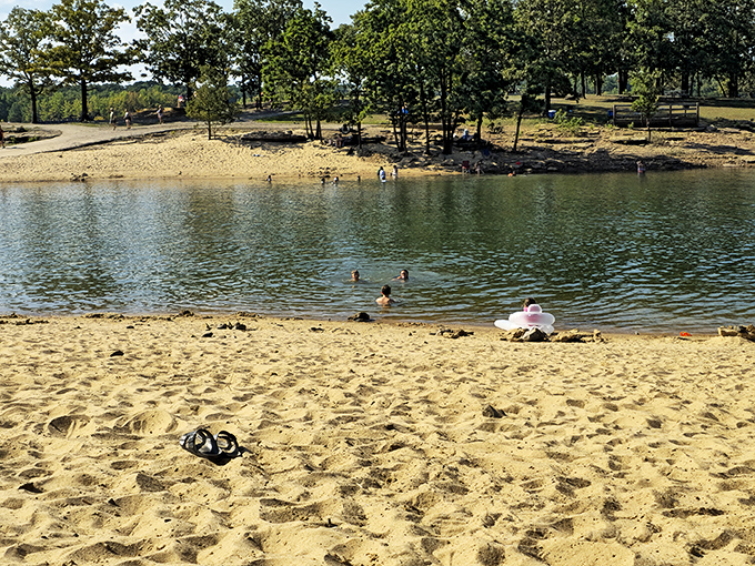 Swimmers enjoying the gentle waters of Asphalt Beach. The kind of place where afternoon dips turn into all-day adventures.