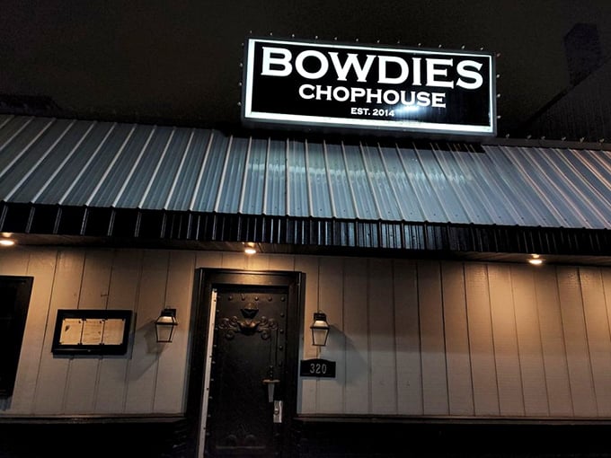 After dark, Bowdie's Chophouse's illuminated sign becomes a lighthouse guiding hungry travelers to a safe harbor of deliciousness.