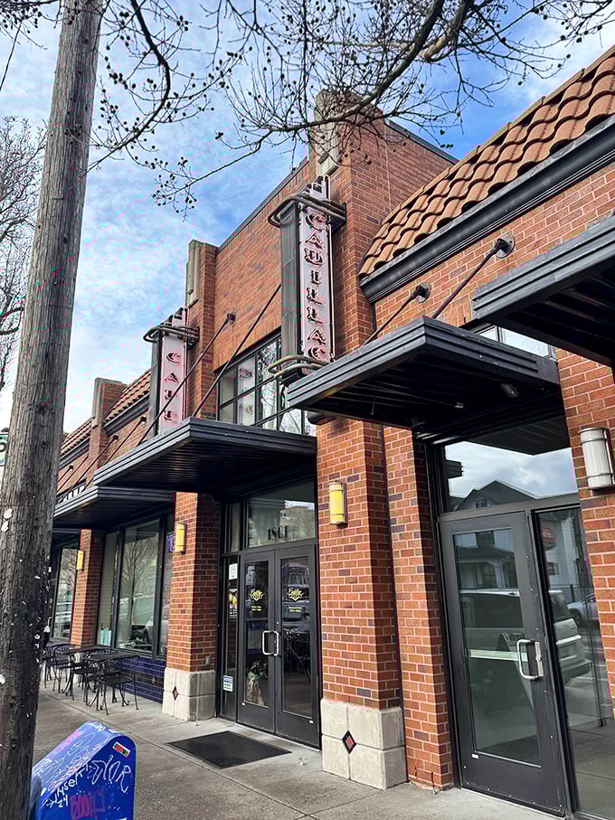 The warm brick facade of Cadillac Cafe glows in morning light &ndash; Portland's answer to breakfast nostalgia.