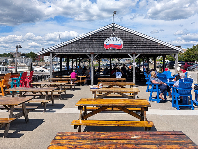 Picnic tables under the pavilion at Captain Scott's&mdash;where memories are made one lobster roll at a time.