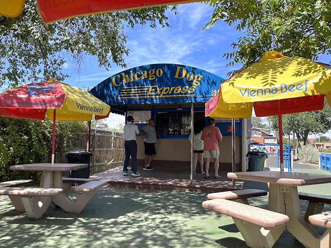 Colorful umbrellas provide shade while you enjoy a proper Chicago dog with "the works" at this beloved Santa Fe stand.