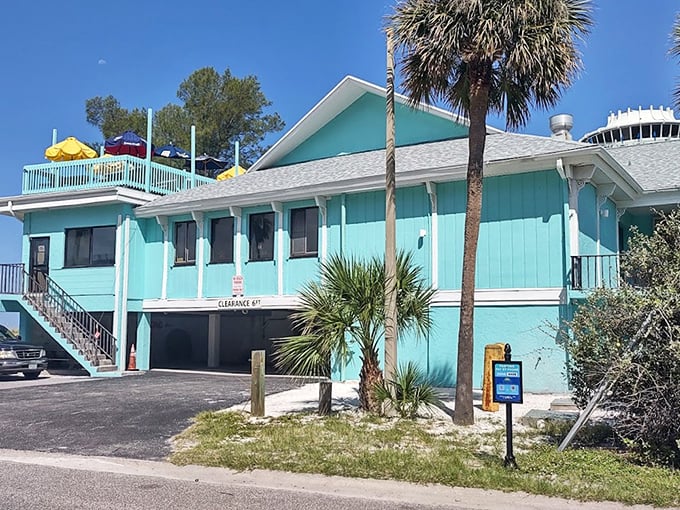 The vibrant blue building with its two-story charm captures classic Florida style. Crabby Bill's colorful character matches the personality of its perfect grouper sandwiches.