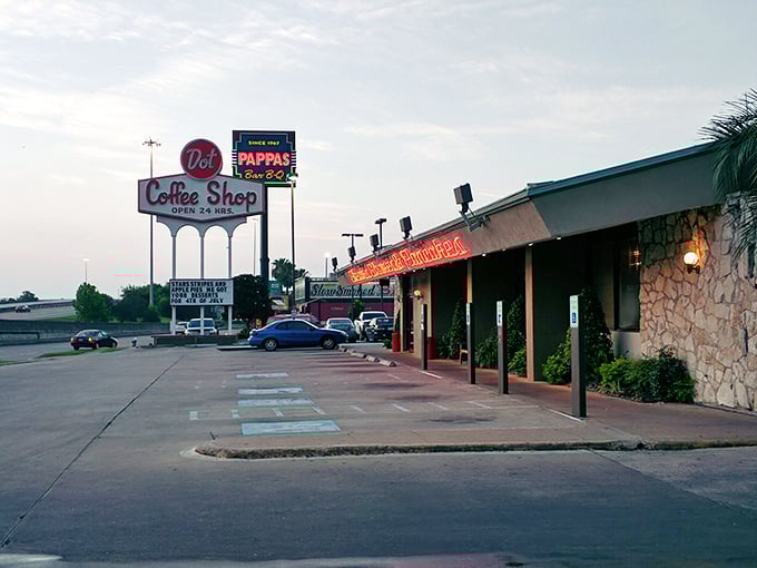 The retro charm of Dot Coffee Shop glows in the evening light. That sign has guided hungry night owls for decades!