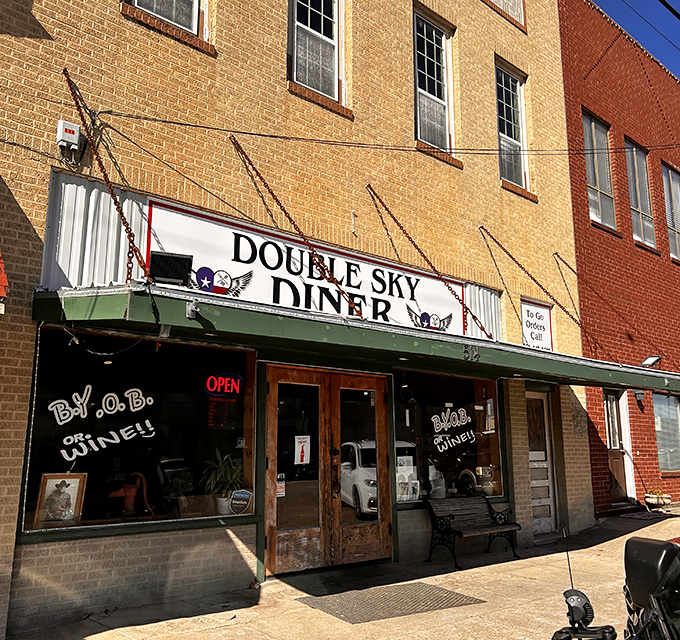 "B.Y.O.B. or WINE" reads the window at Double Sky Diner, where pancakes the size of hubcaps await inside this historic building.