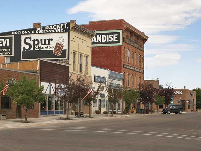 Historic storefronts and vintage signs line Evanston&rsquo;s main street, creating a warm and nostalgic atmosphere in this inviting Wyoming town.