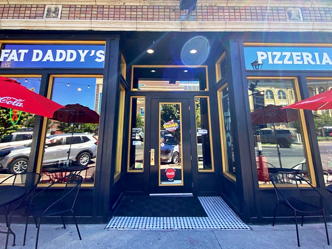 Sunshine gleams off Fat Daddy's windows, inviting pizza pilgrims inside. The black and gold exterior hints at the treasures within.
