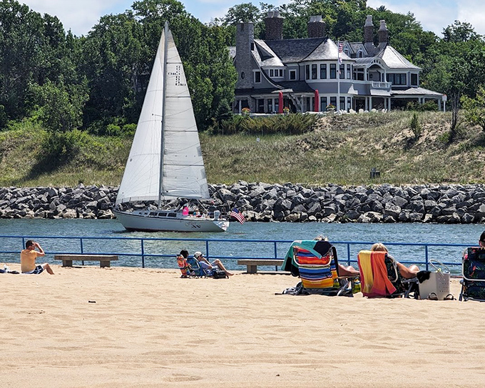 A sailboat glides past Ludington's shore &ndash; making everyone on land wonder if they chose the wrong vacation activity.